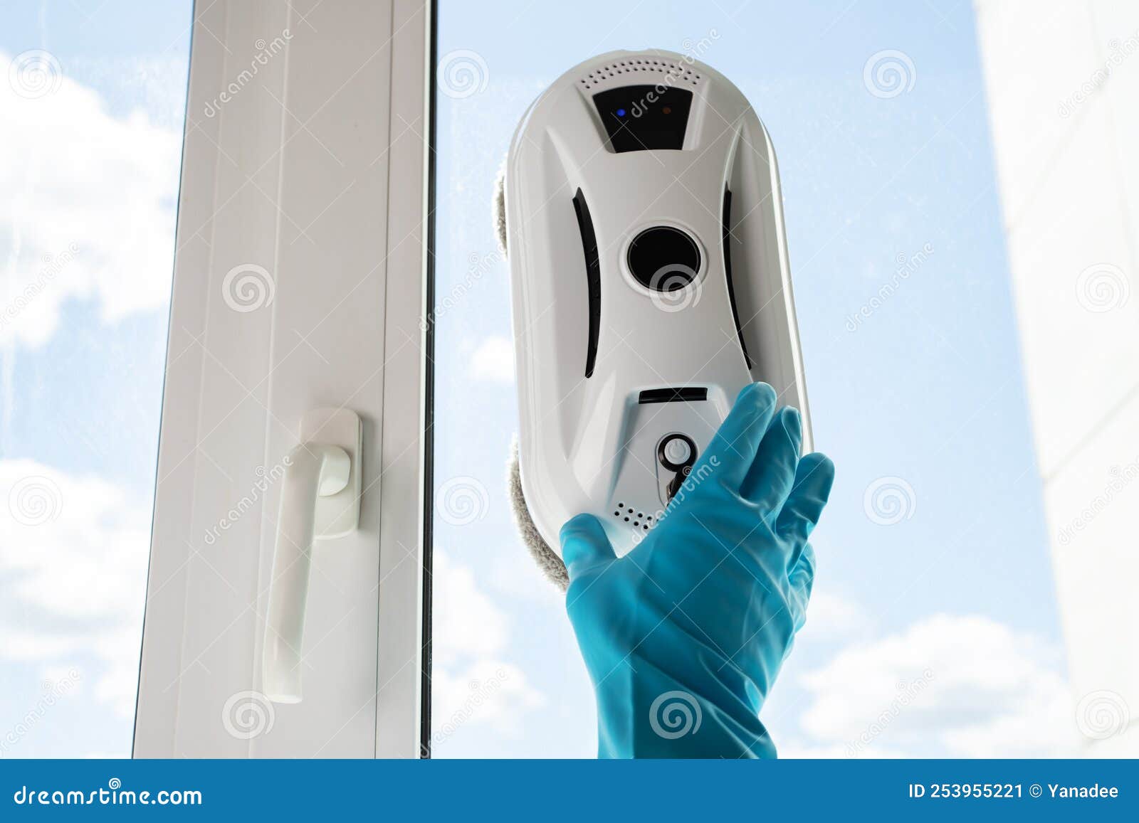 Robot Window Cleaner, Hand Installs the Glass Washer on the Window ...