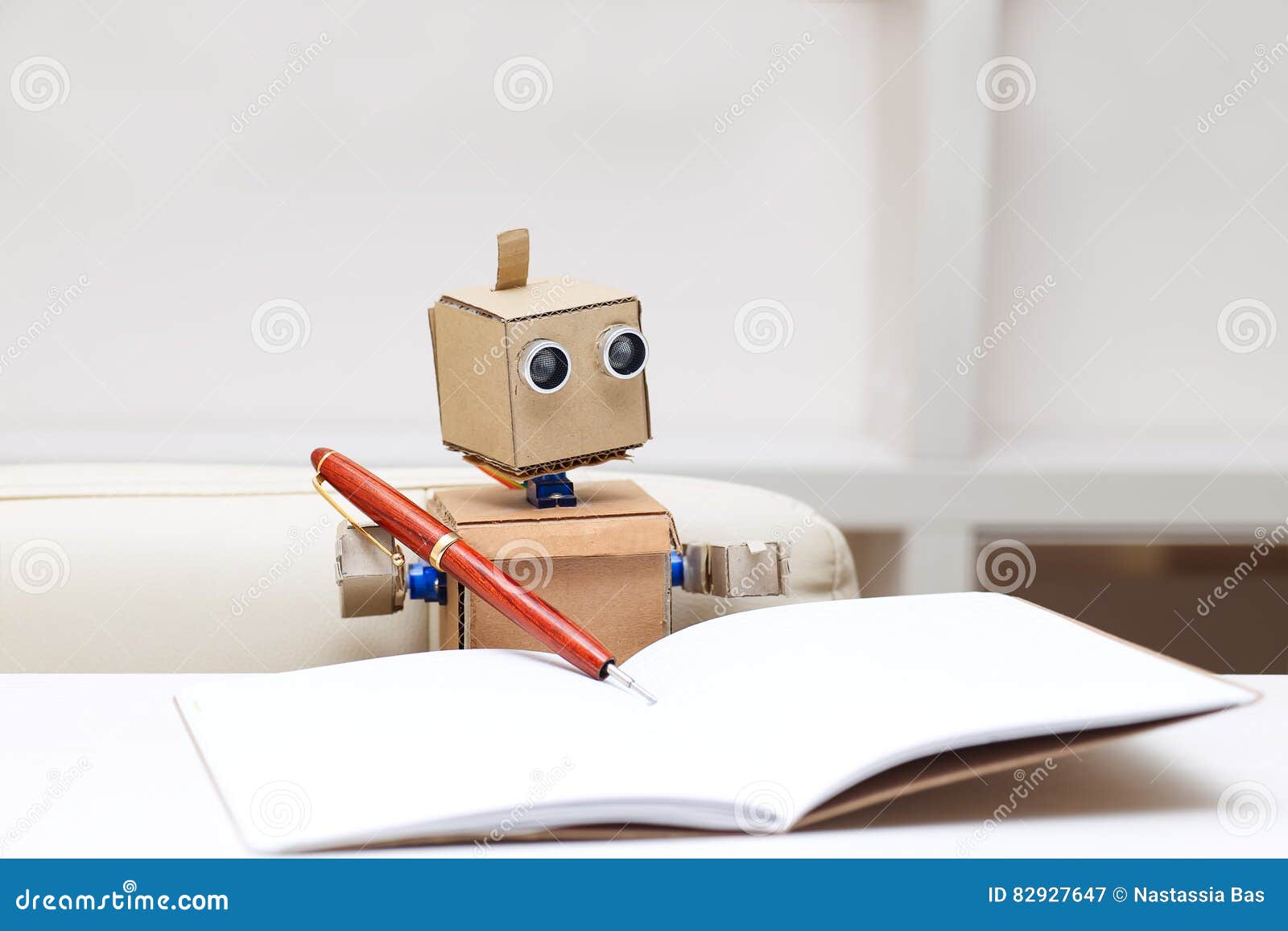 Robot Writes Sitting at White Table in Writing Stock Image - Image of ...