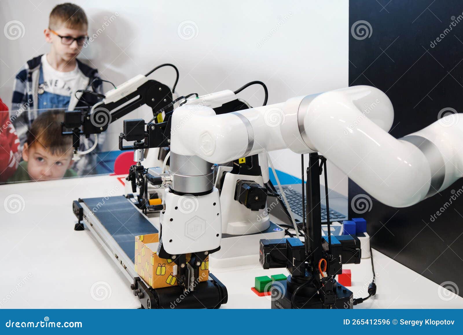 A Robotic Arm Demonstrates To a Group of Children the Possibilities of ...