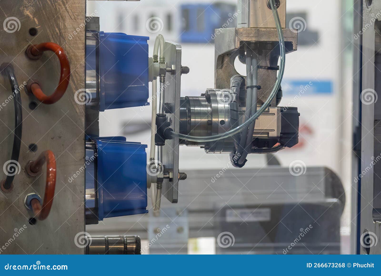 The Robotic Arm Gripping the Plastic Container Part at Injection ...