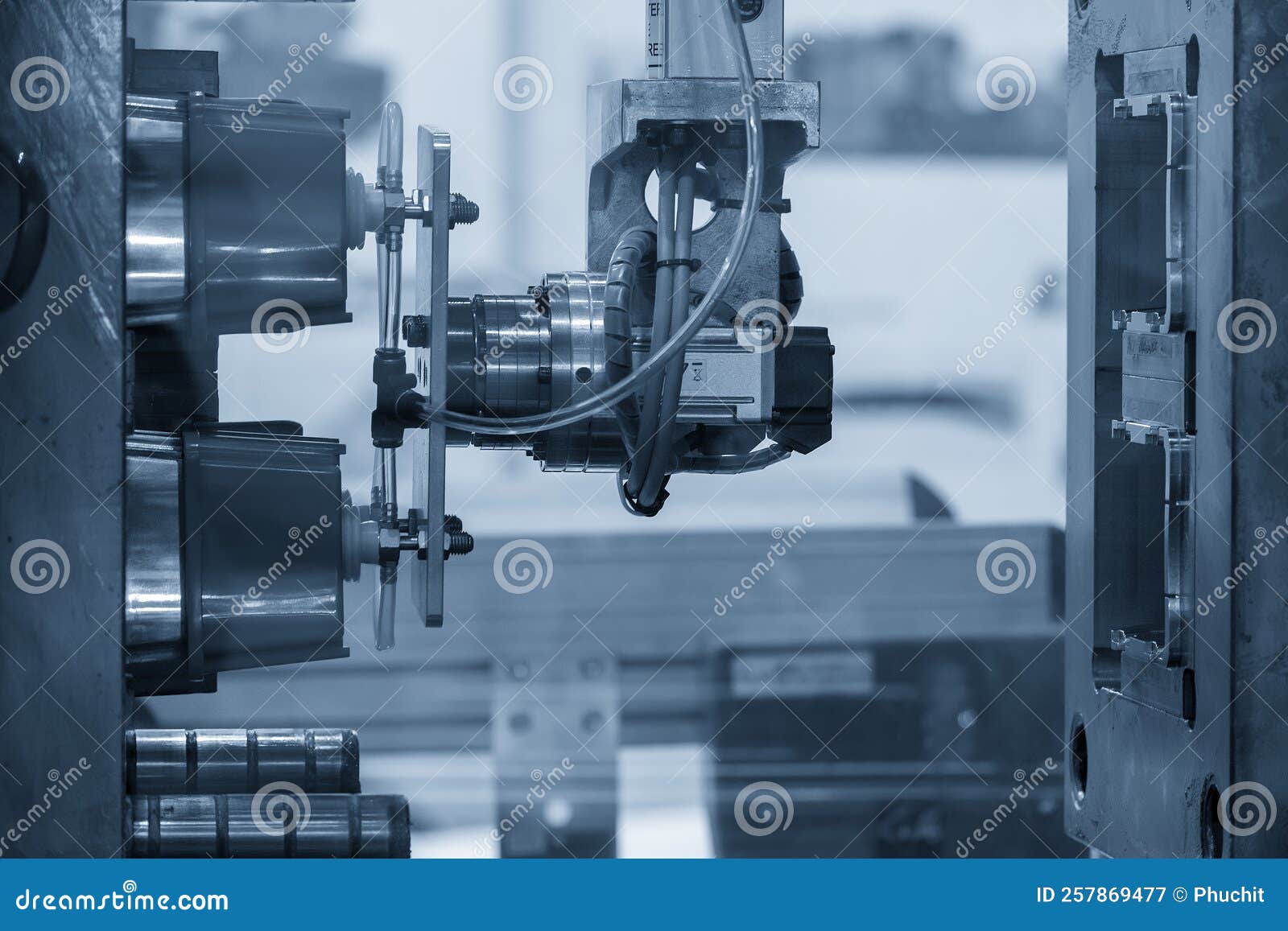 The Robotic Arm Gripping the Plastic Cup from the Injection Machine ...