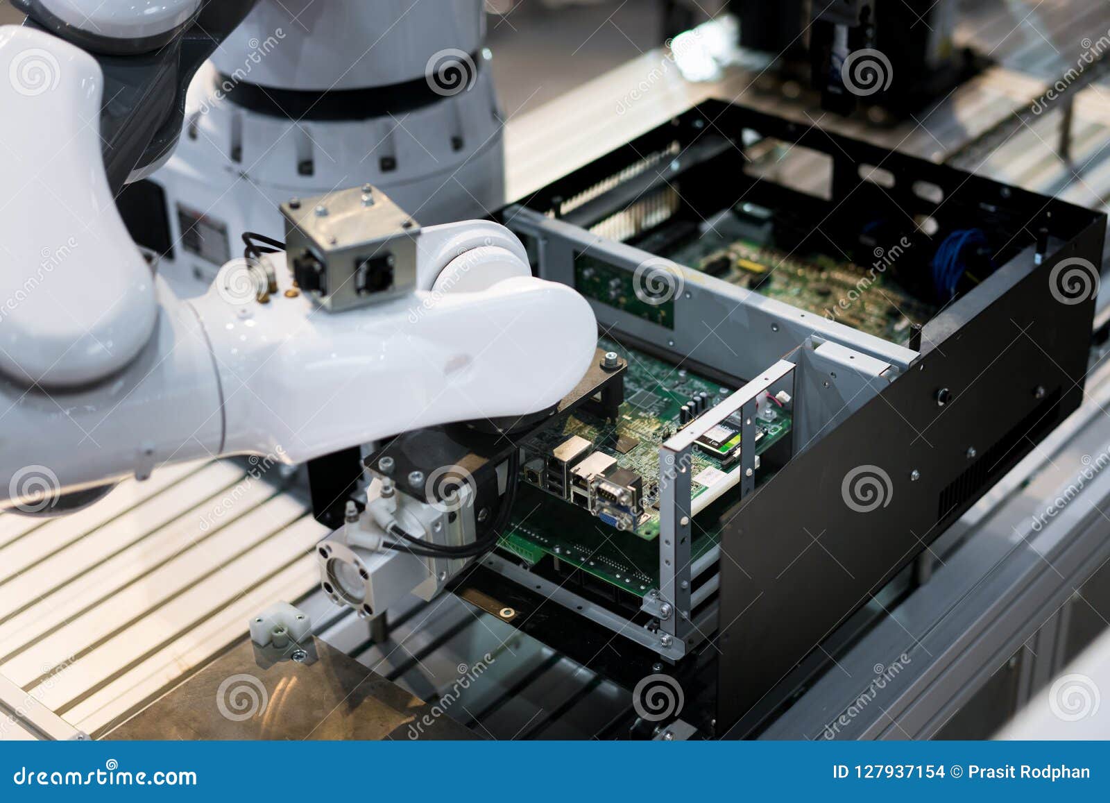 Robotic Arm Installing a Computer Chip in Factory. Industrial an Stock ...