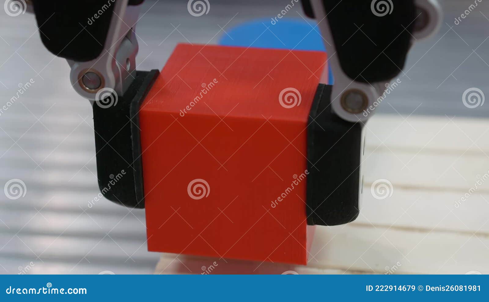 A Robotic Arm Moves a Cube-shaped Part. Stock Video - Video of moving ...