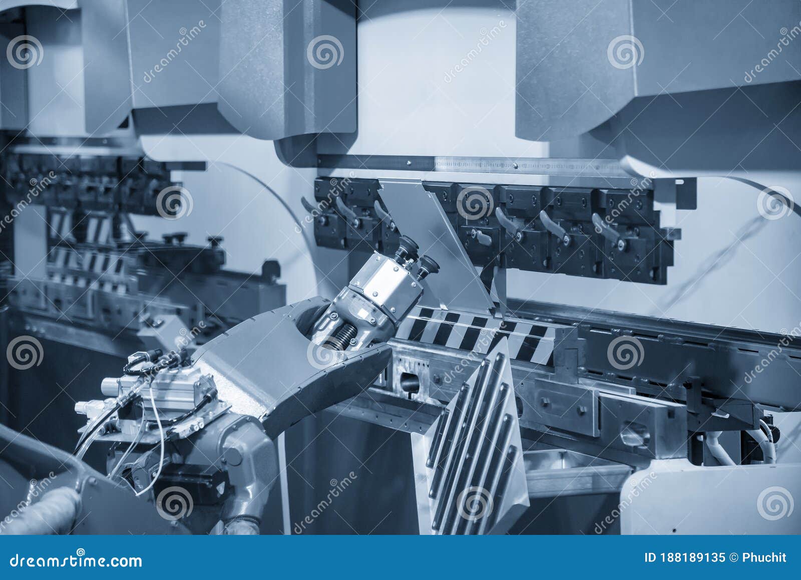 The Robotic Arm Operation at Hydraulic Bending Machine. Stock Image ...