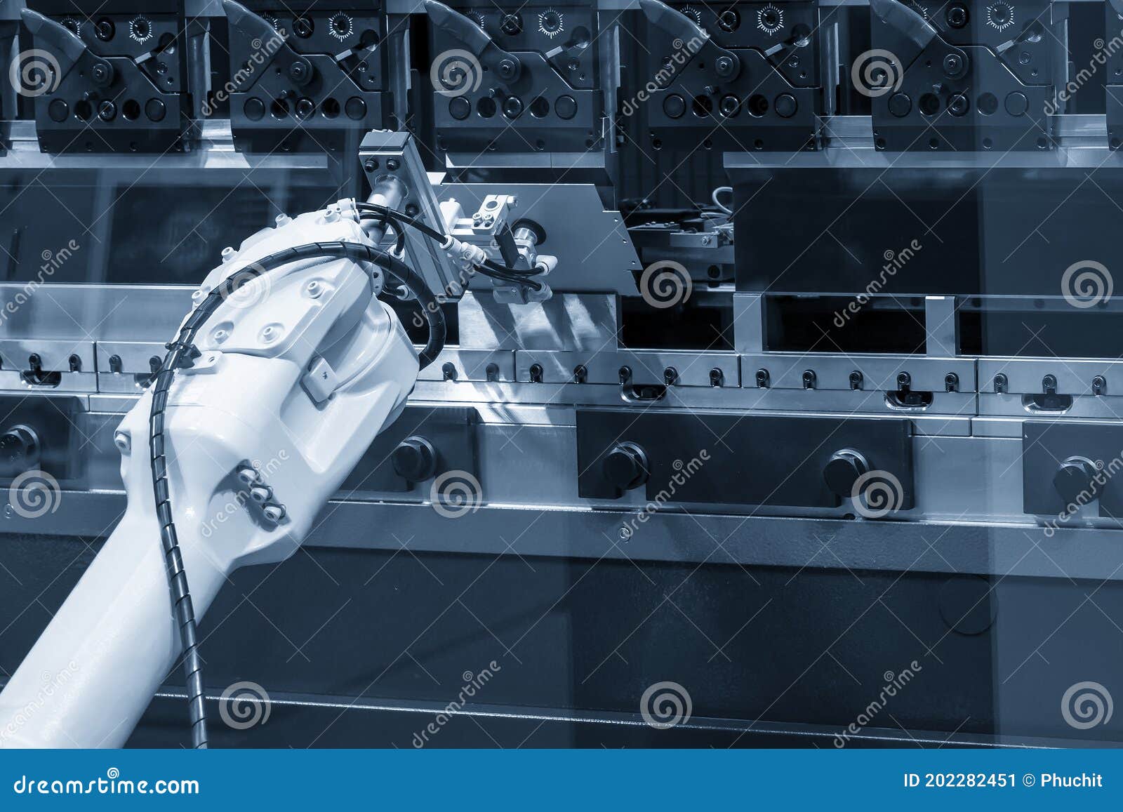 The Robotic Arm Operation at Hydraulic Bending Machine. Stock Image ...