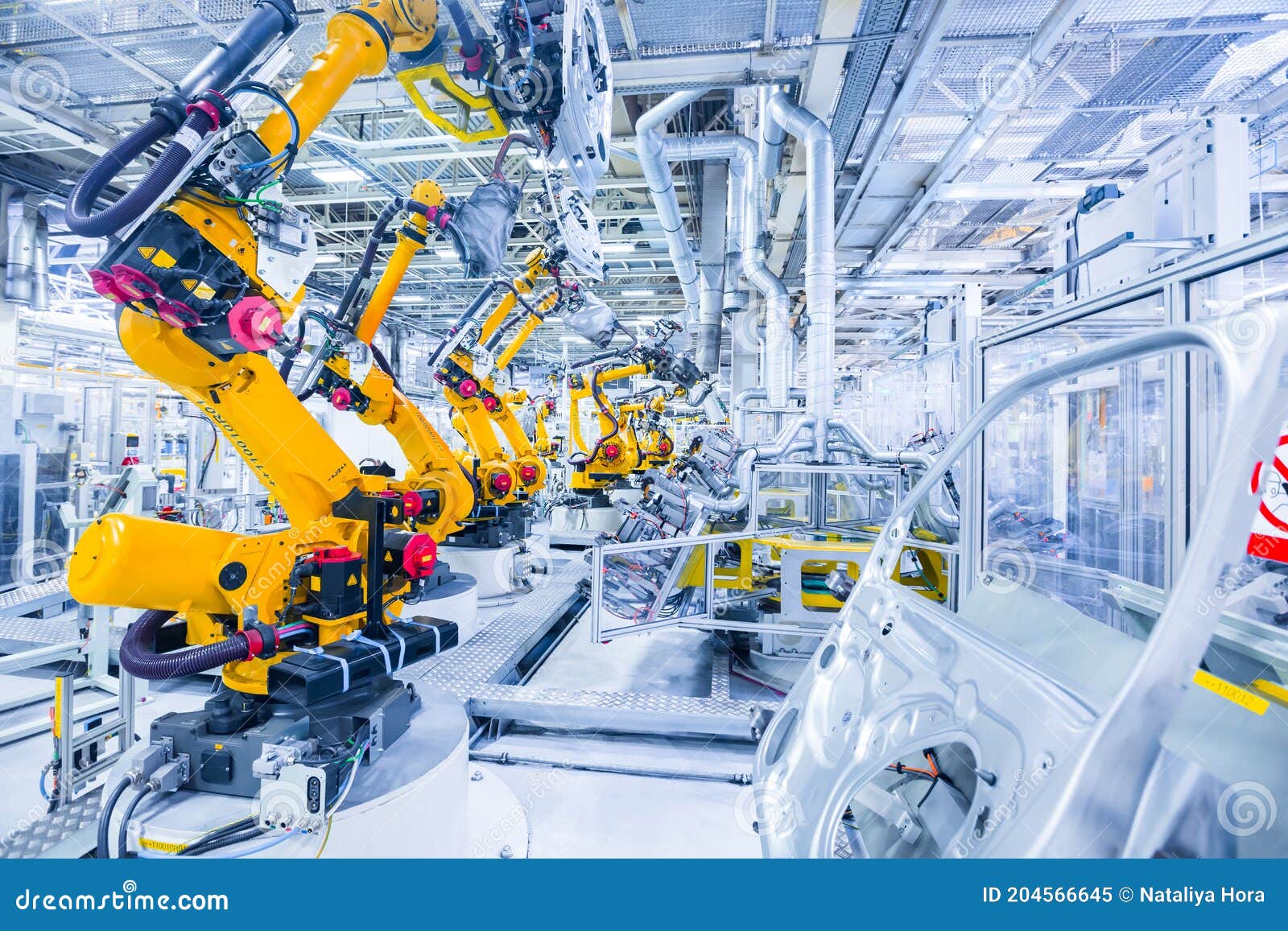 Robots in a car plant stock image. Image of conveyor - 204566645