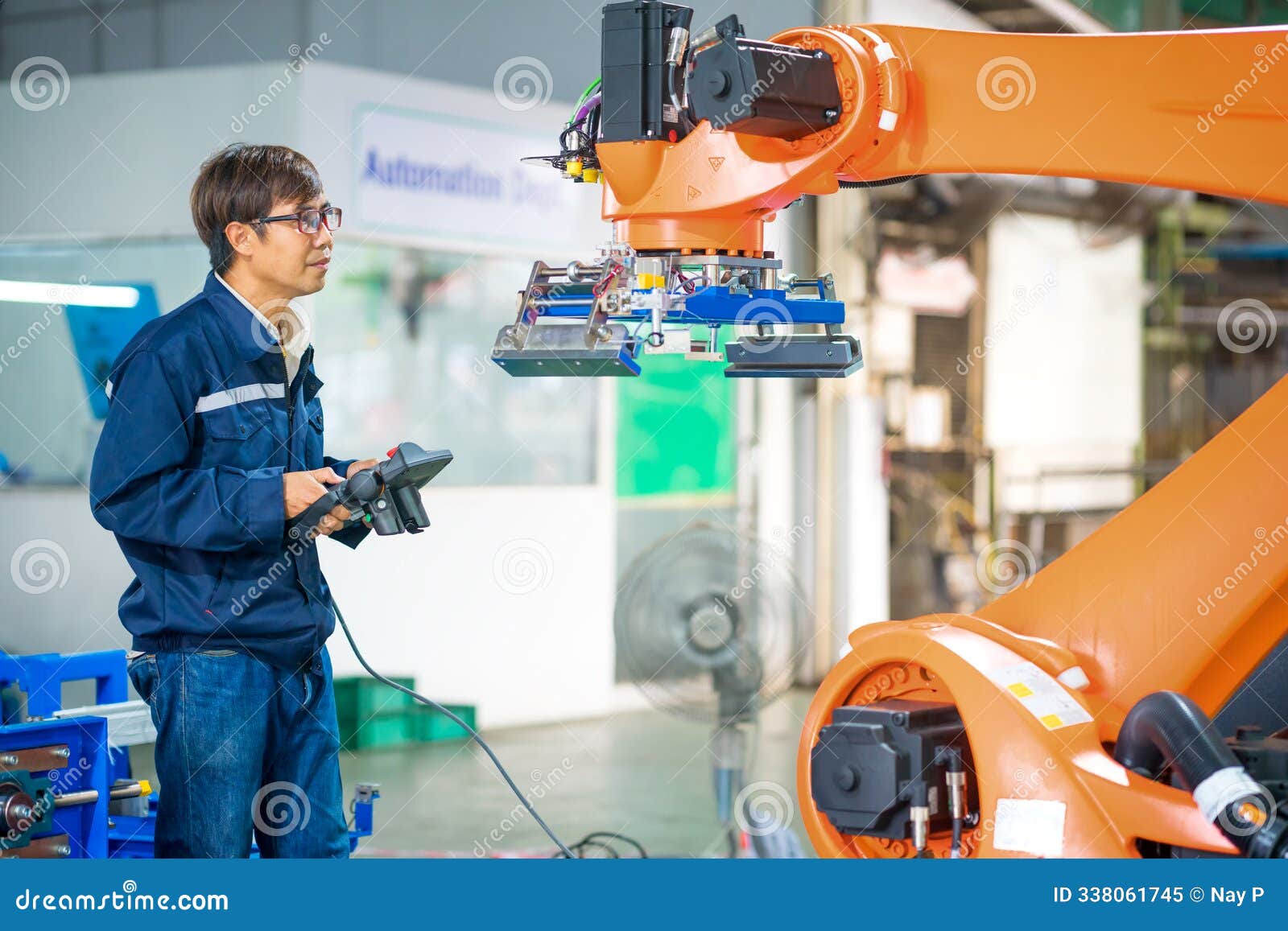 Robotic Engineer is Setting Handling Robot during Installation ...