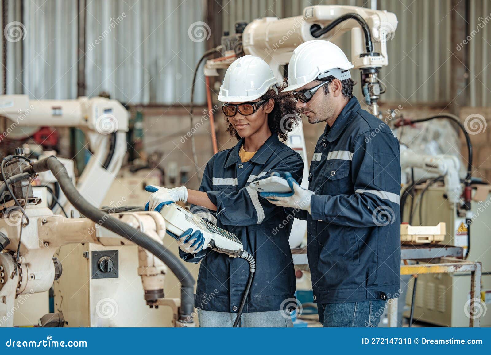 The Robotic Welding Supervisor Advice Female Worker To Use a Remote ...