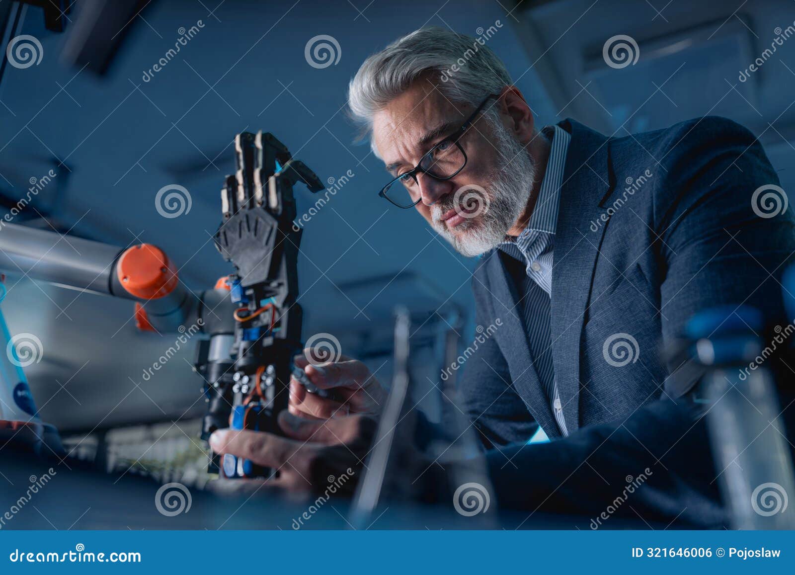 Robotics Engineer Adjusting, Calibring Robotic Prosthetic Hand. Concept ...