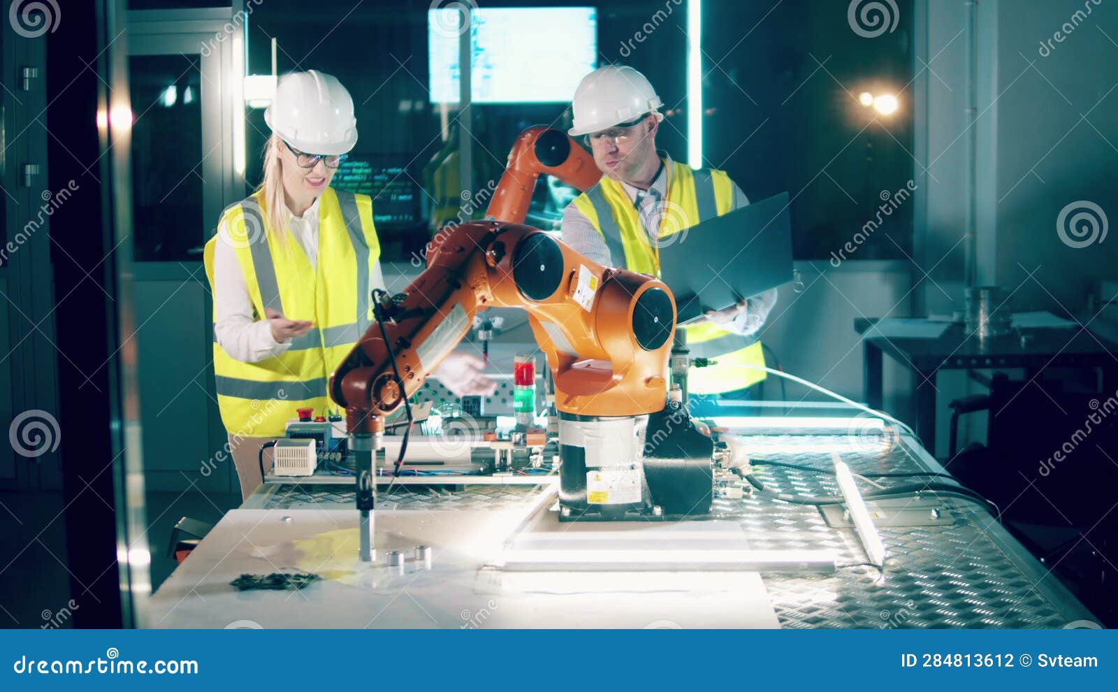 Robotics Engineers are Observing a Robotic Arm in Modern Lab Stock ...