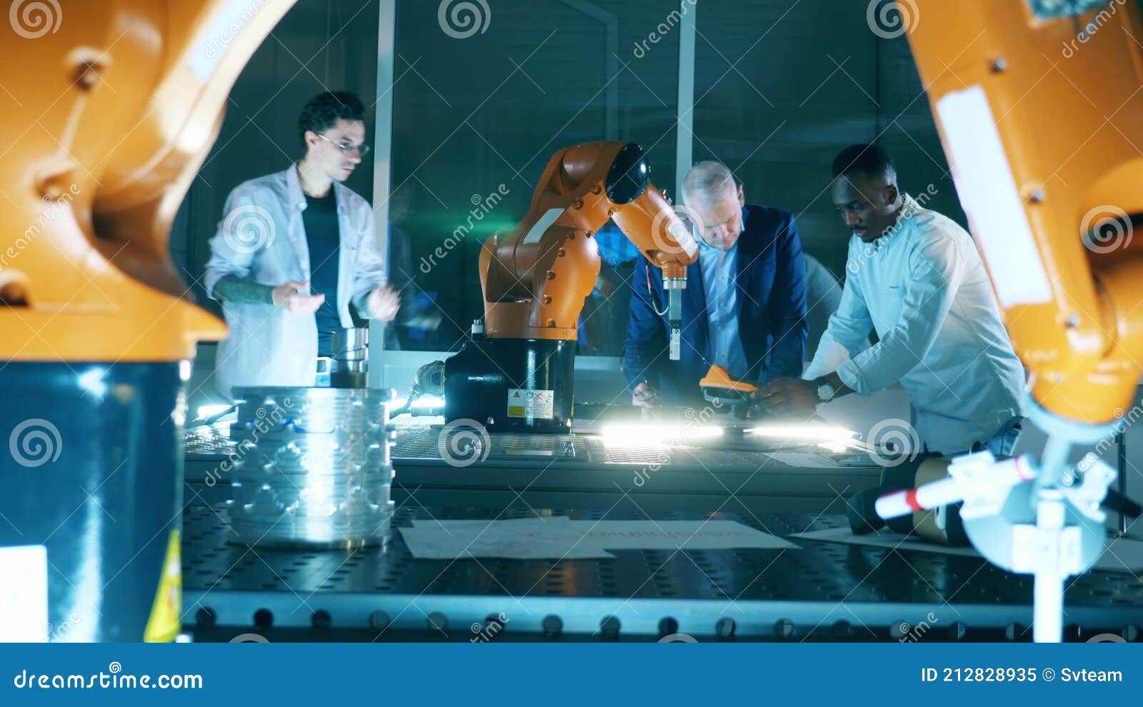 Robotics Laboratory with a Team of Researchers Holding Experiments ...