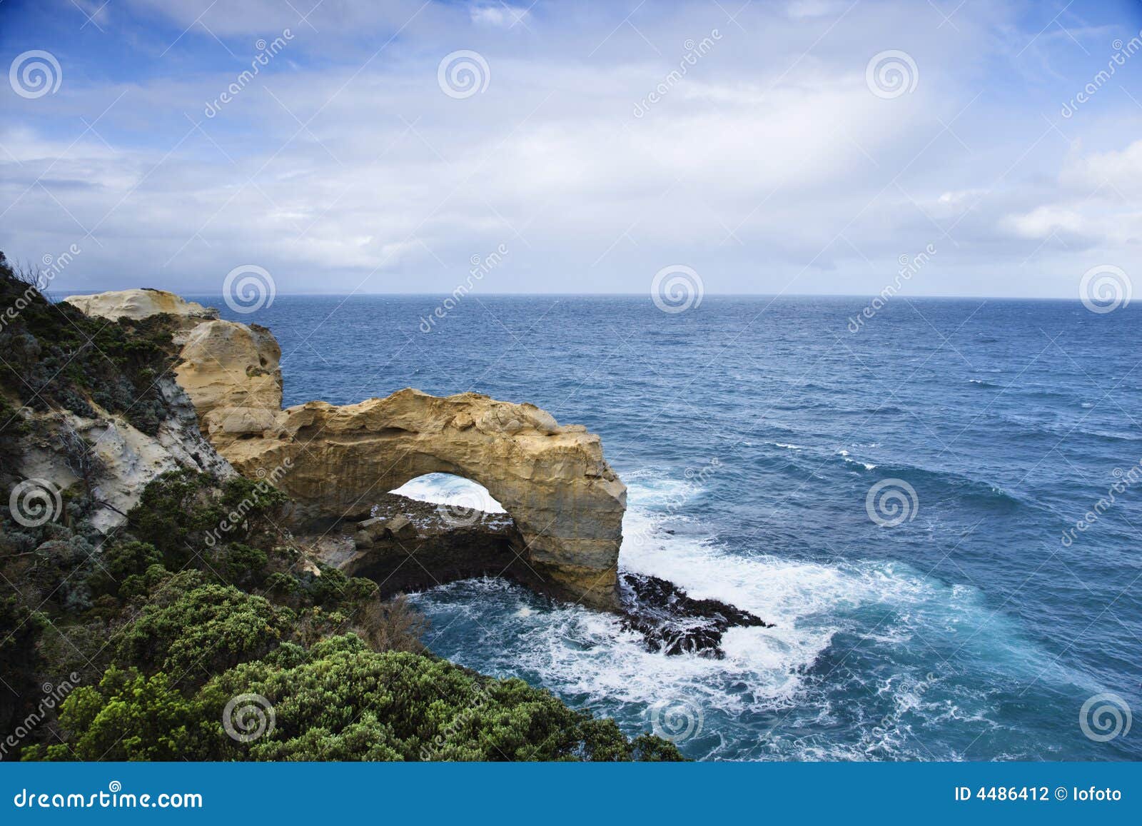 Rock arch in ocean. stock photo. Image of beach, scenic - 4486412