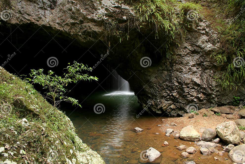 Rock arch and waterfall stock image. Image of cascading - 1442169