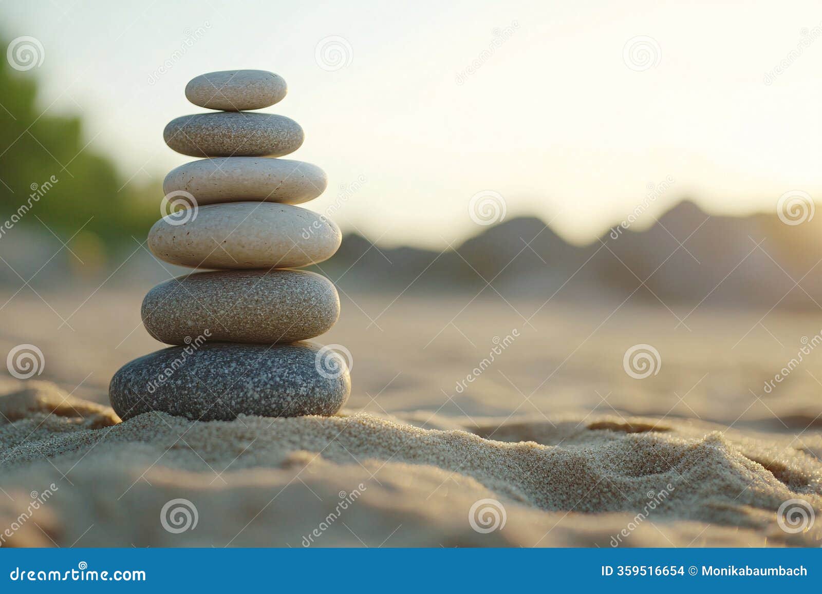 Rock Balancing. Stones Piled In Balanced Stacks In Front Of Blurry ...