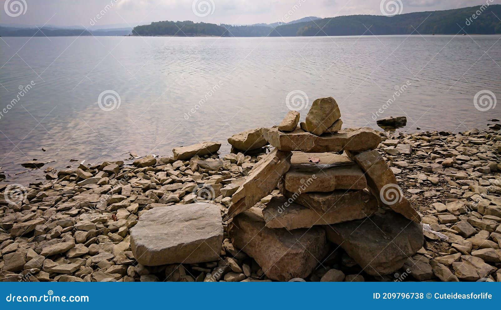 Rock Balancing or Stone Balancing Figure on Lake Shore Stock Photo ...