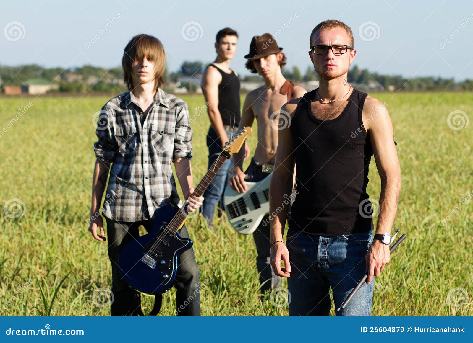 Rock band in field stock image. Image of guys, looking - 26604879