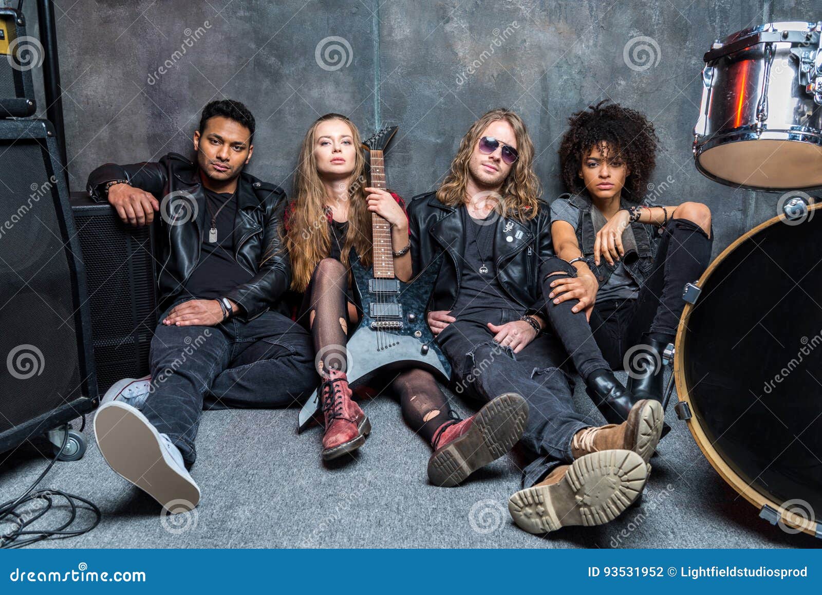 Rock Band Sitting on Floor while Resting after Rehearse Stock Photo ...