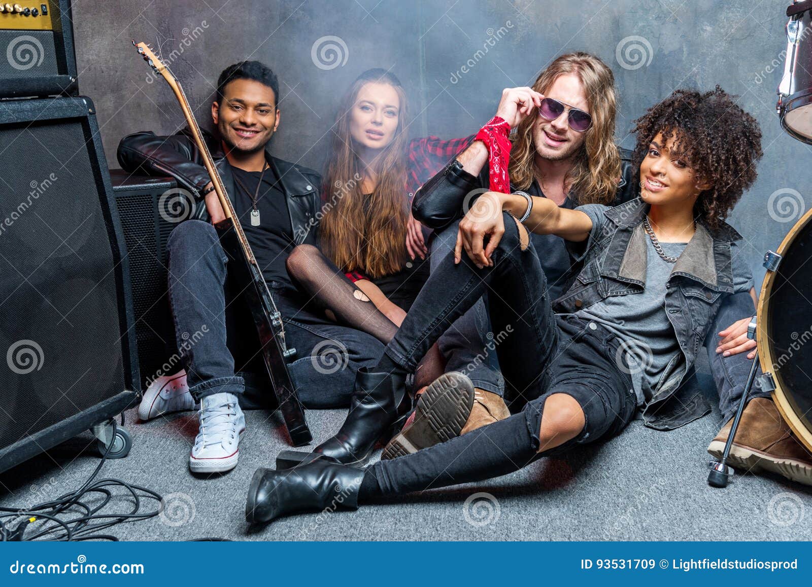 Rock Band Sitting on Floor while Resting after Rehearse in Studio Stock ...