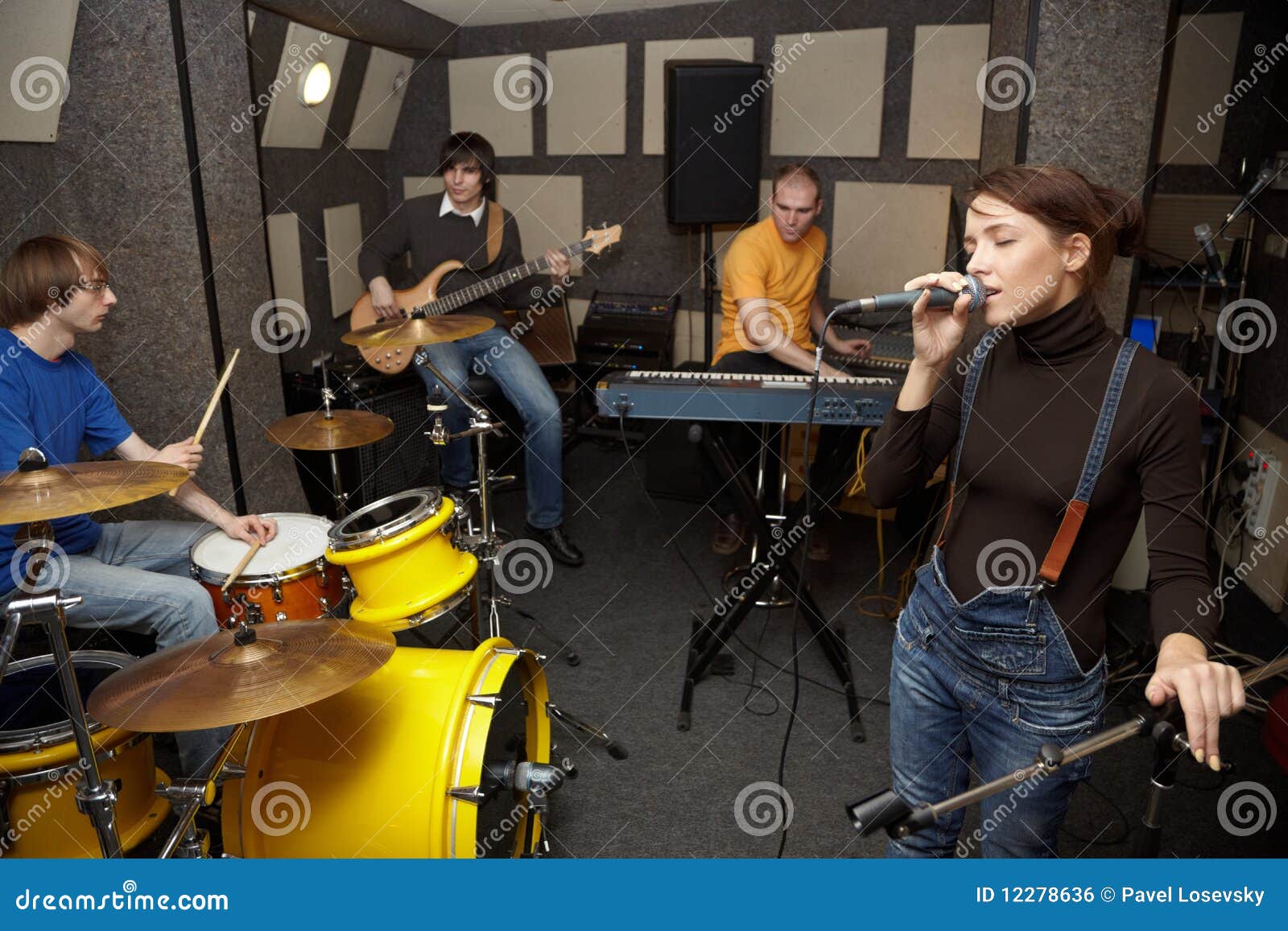Rock Band in Studio. Vocalist Girl is Singing Stock Photo - Image of ...