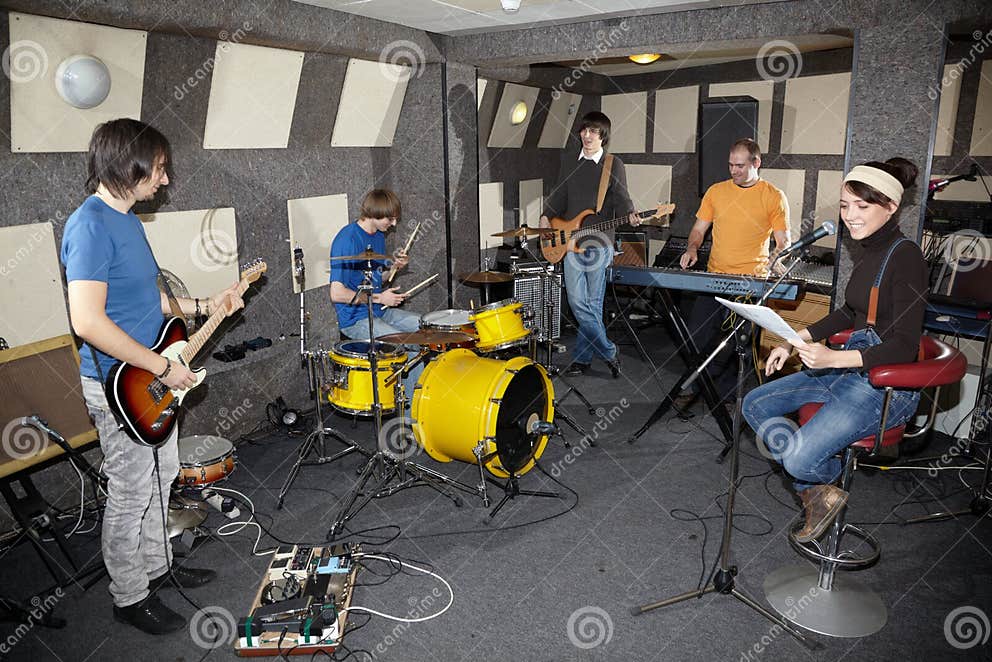 A Rock Band Working in Studio Stock Photo - Image of music, drumkit ...