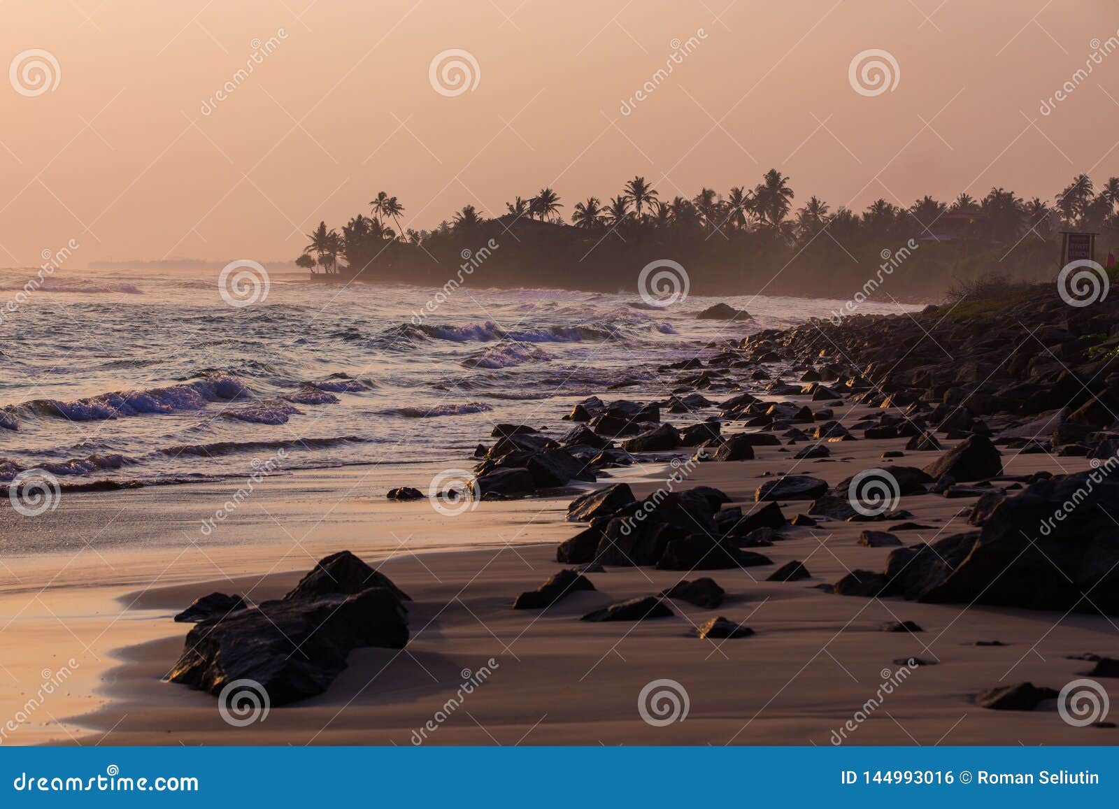 Rock beach at sunset stock photo. Image of scenery, resort - 144993016