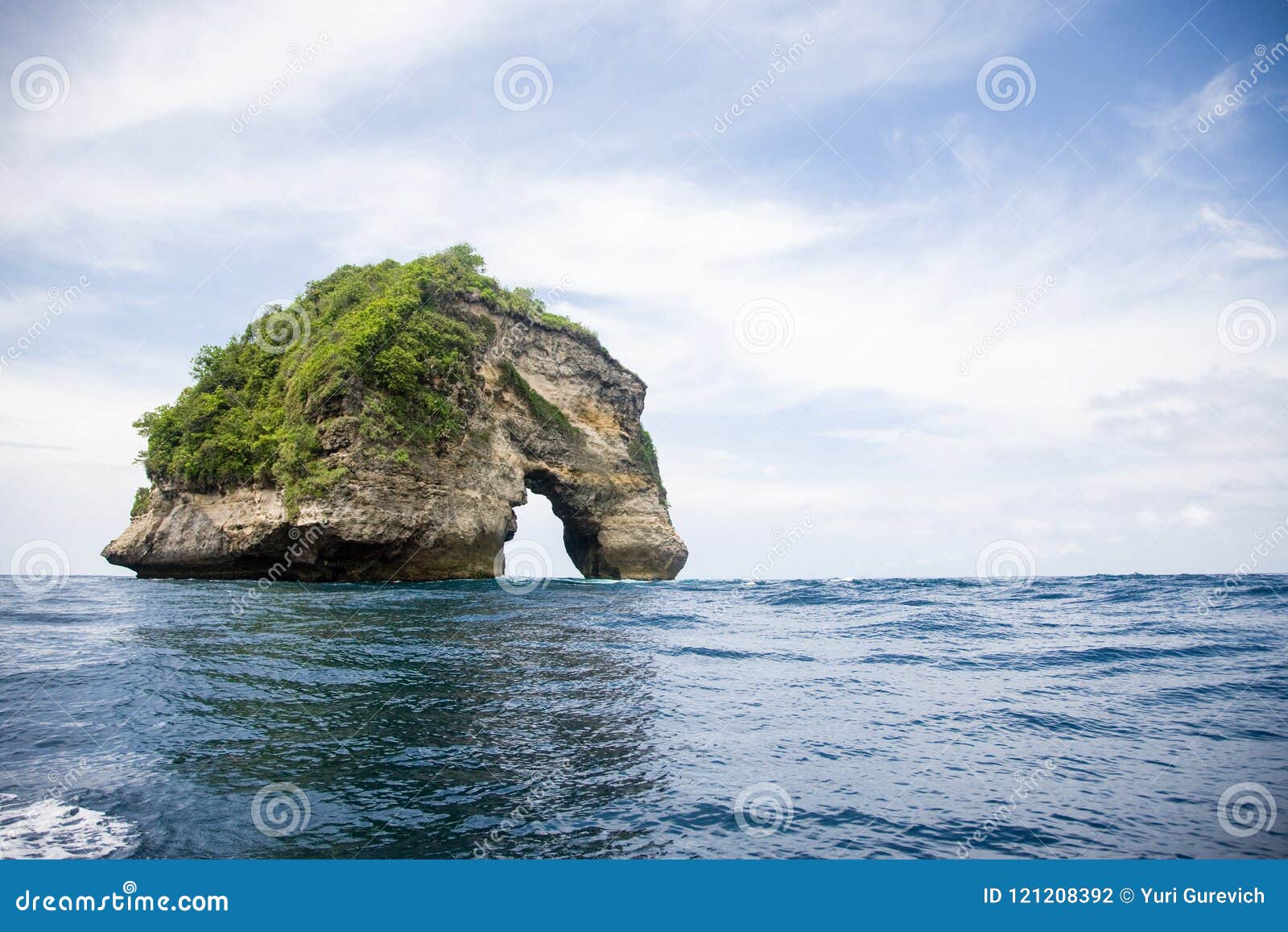 Bali Rock in the ocean stock photo. Image of water, rock - 121208392