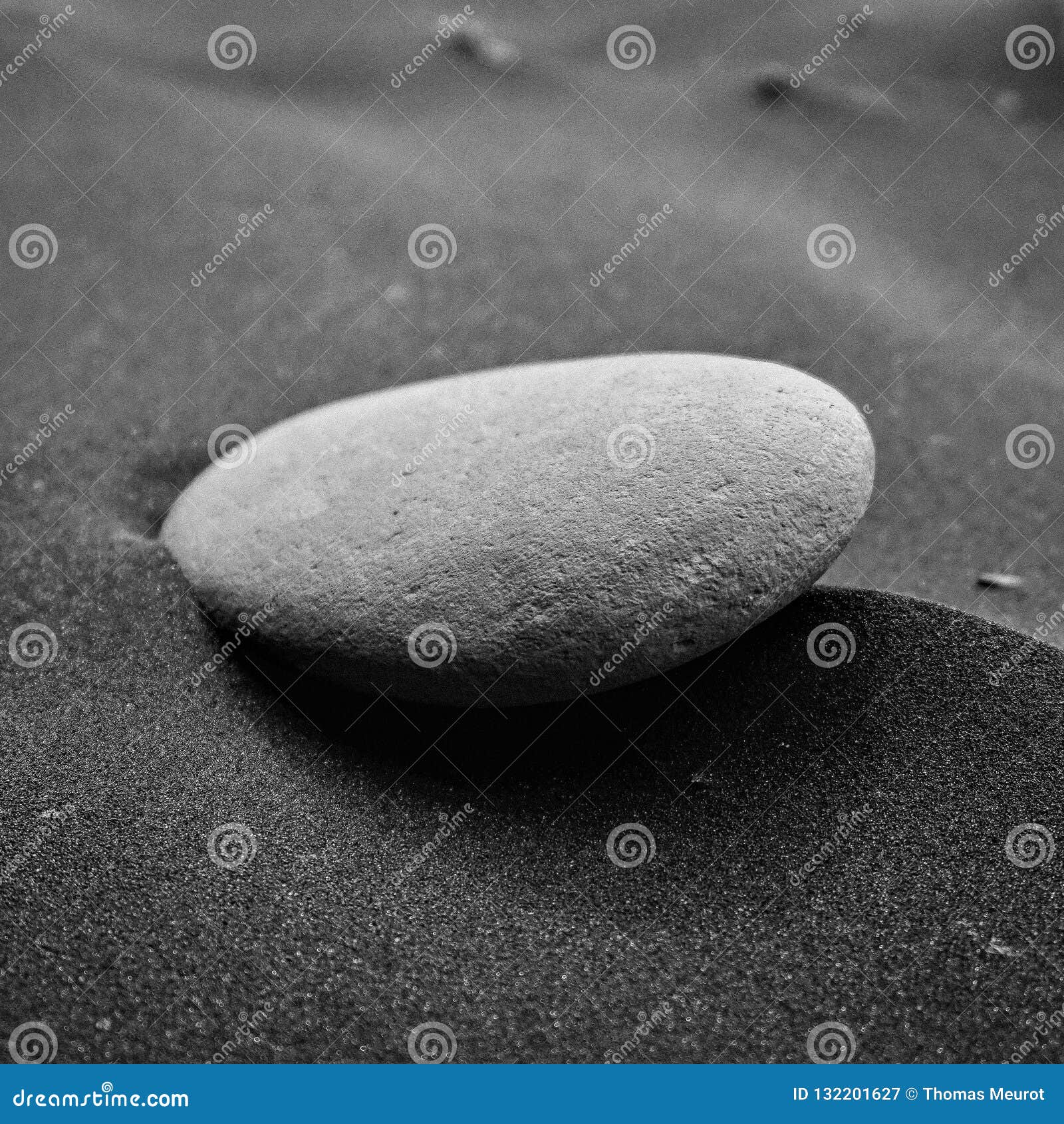 Rock on black sand stock image. Image of texture, balance - 132201627
