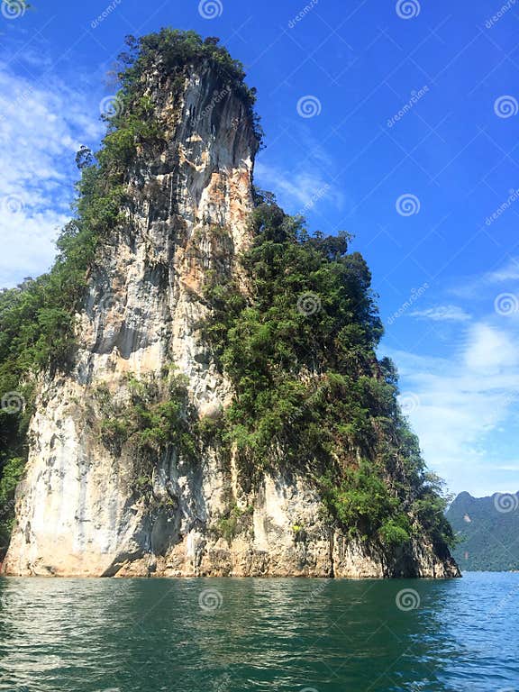 Rock with Blue Sky and Lake Stock Photo - Image of rock, blue: 62825856