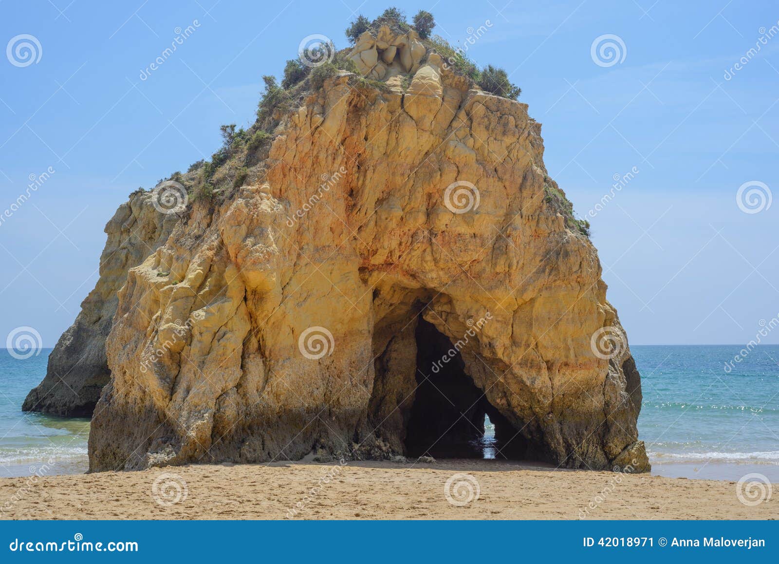 Rock with Cave in the Ocean Stock Image - Image of seaside, natural ...