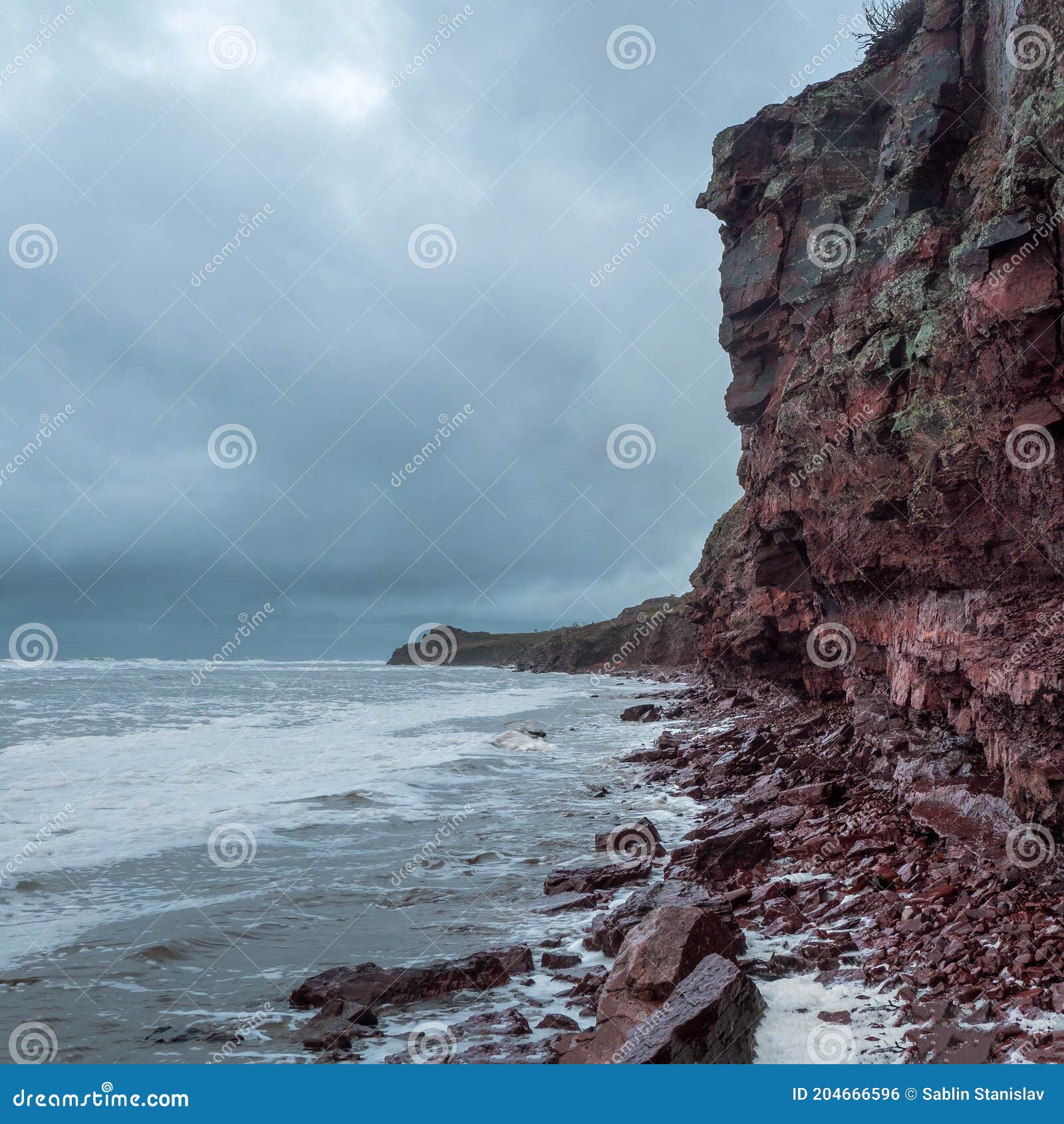 A Rock Cliff Above the Water with a Tidal Shoreline. White Sea Stock ...
