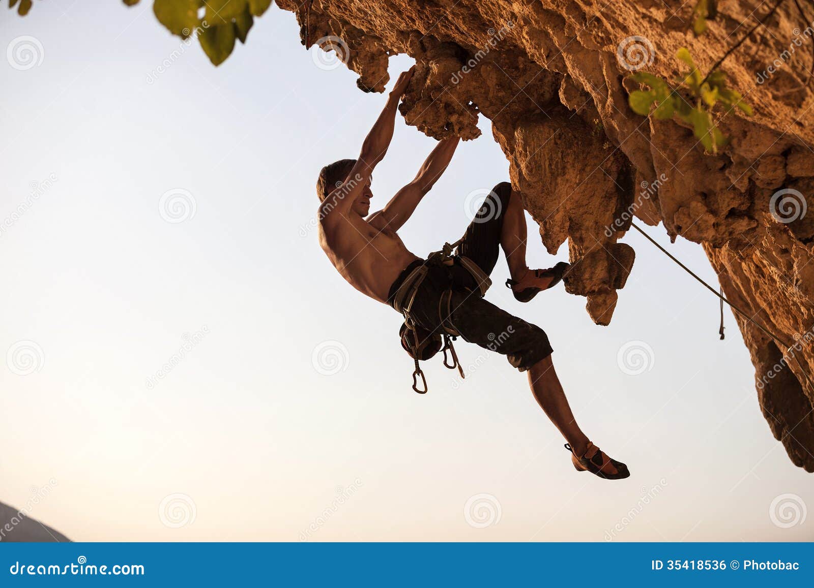 Rock climber of a cliff stock photo. Image of climber - 35418536