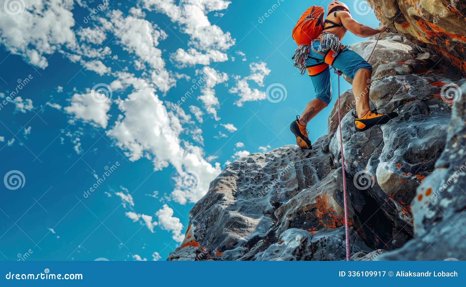 A Rock Climber Climbing the Cliff of a Mountain. Free Climbing Stock ...