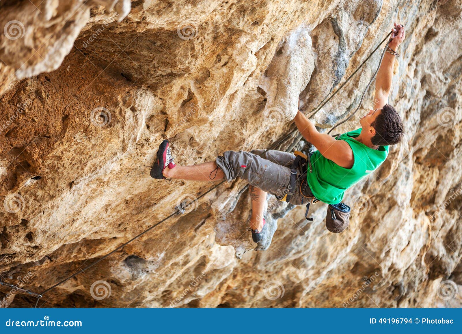 Rock Climber on a Face of a Cliff Stock Photo - Image of full, cling ...