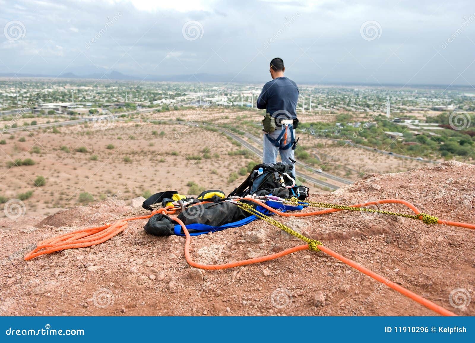 Rock Climber Getting Ready To Rappell Stock Photo - Image of equipment ...