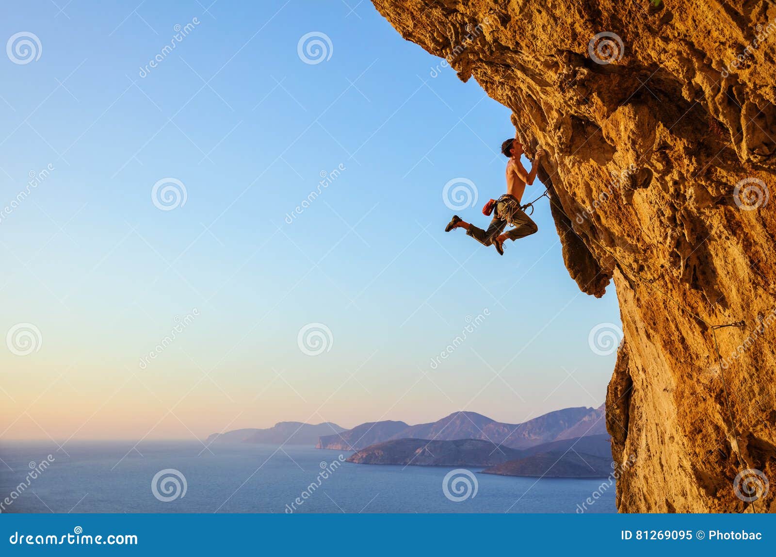 Rock Climber Jumping on Handholds while Climbing Cliff Stock Image ...