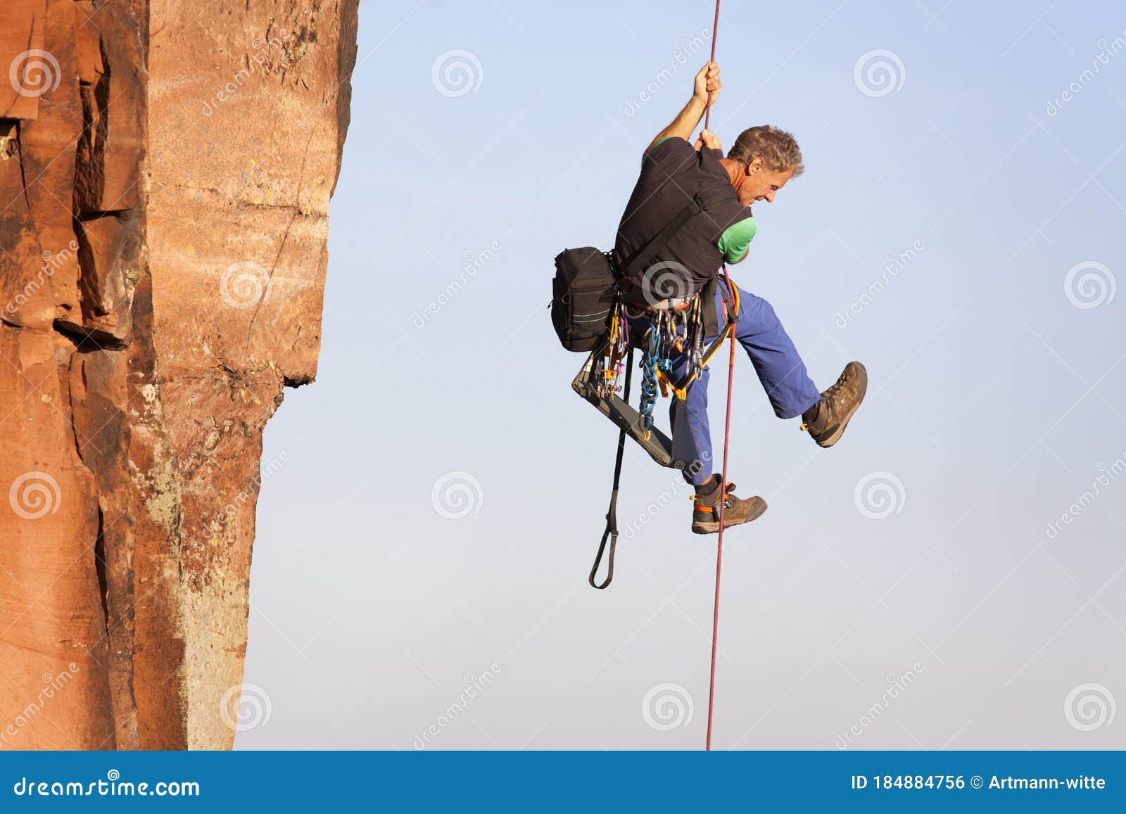 Rock Climber and Photographer Ascending a Rock on a Rope Stock Photo ...