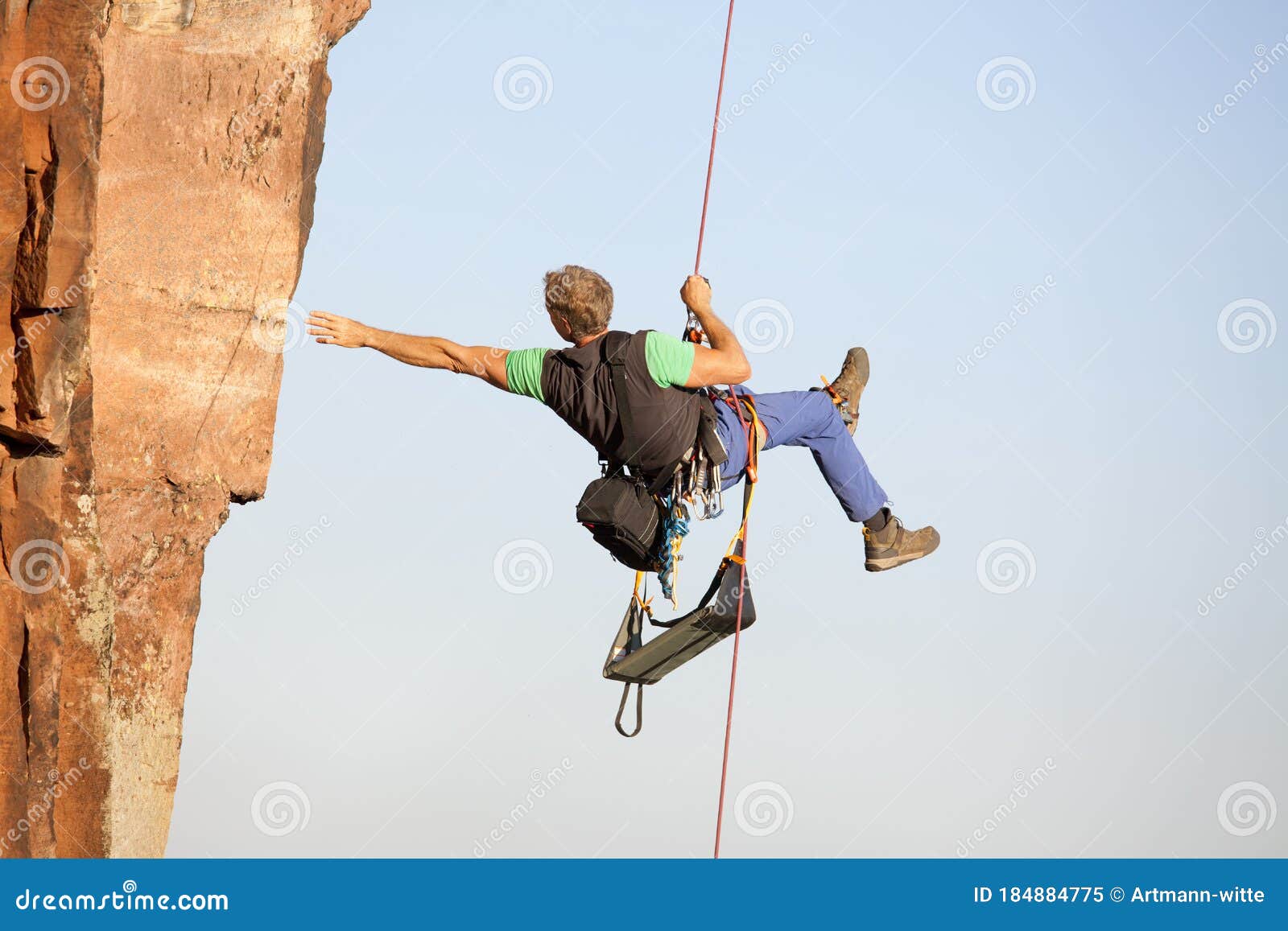 Rock Climber and Photographer Ascending a Rock with a Rope Stock Image ...