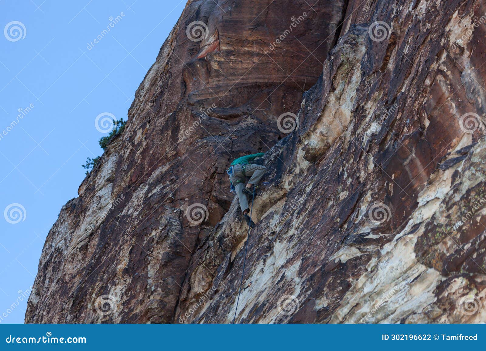 Rock Climber Reaching Ledge on Rock Wall Stock Photo - Image of shade ...