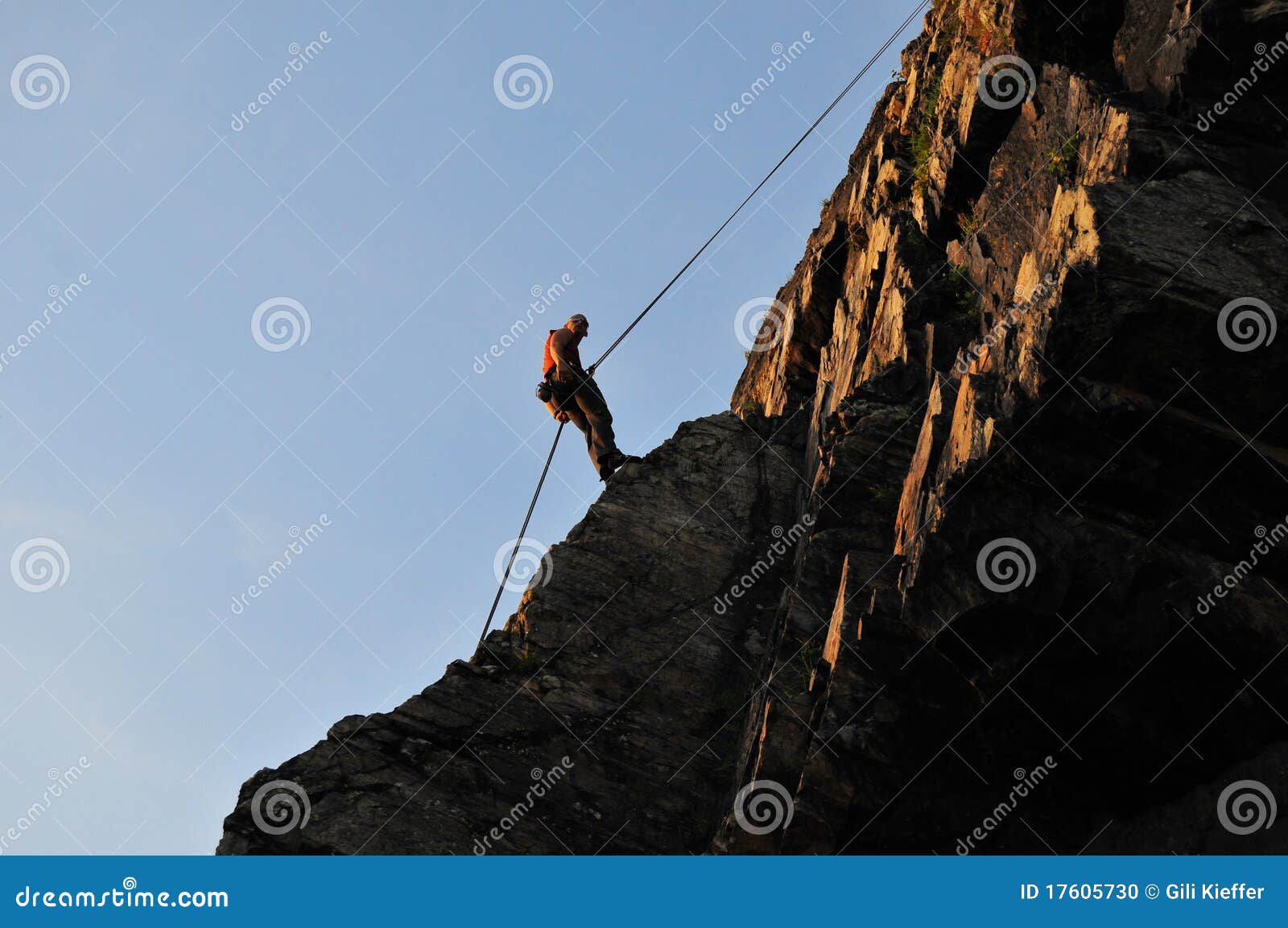 Rock climber repelling stock photo. Image of climber - 17605730