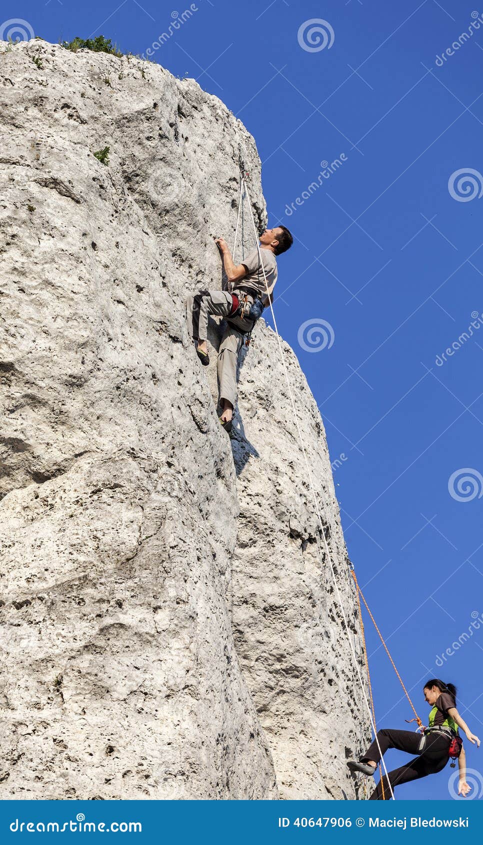 Rock climbers in action. stock photo. Image of grasp - 40647906