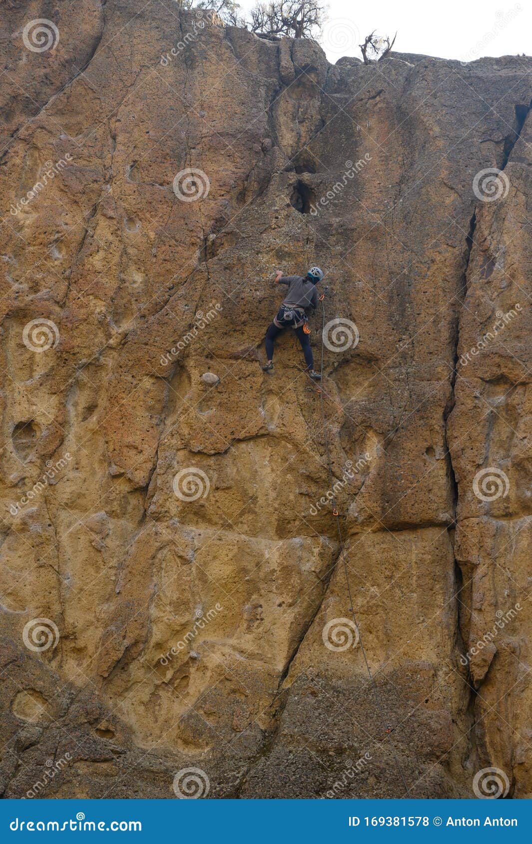 Rock Climbers Climb a Large Rock, Filmed from the Back Stock Photo ...