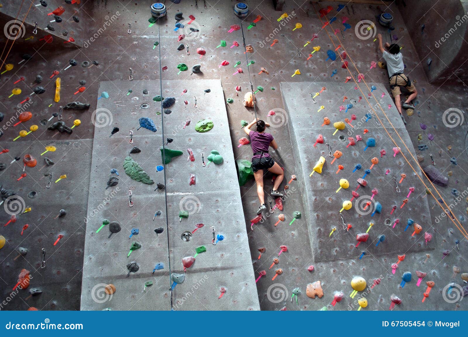 Rock Climbing. A Young Climber Climbs A Vertical Granite Rock. Extreme ...