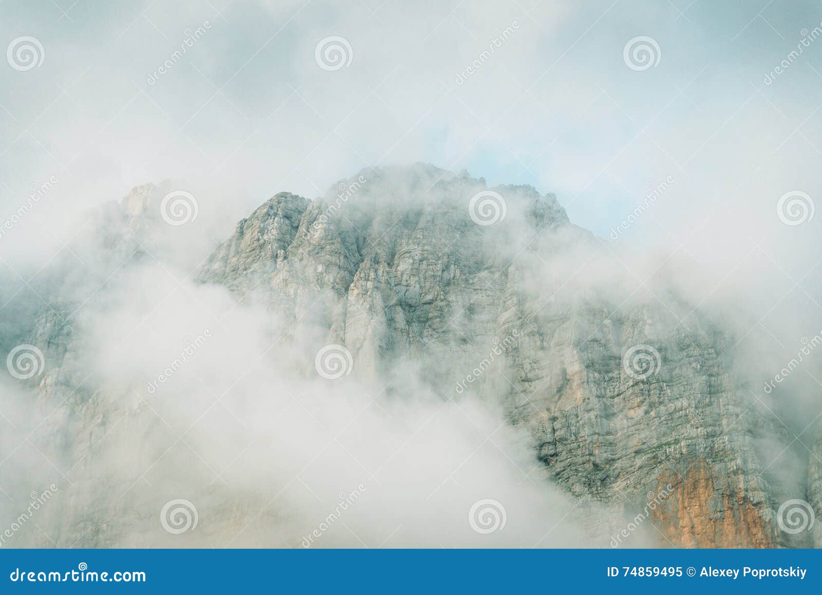 Rock in the clouds stock image. Image of background, peak - 74859495