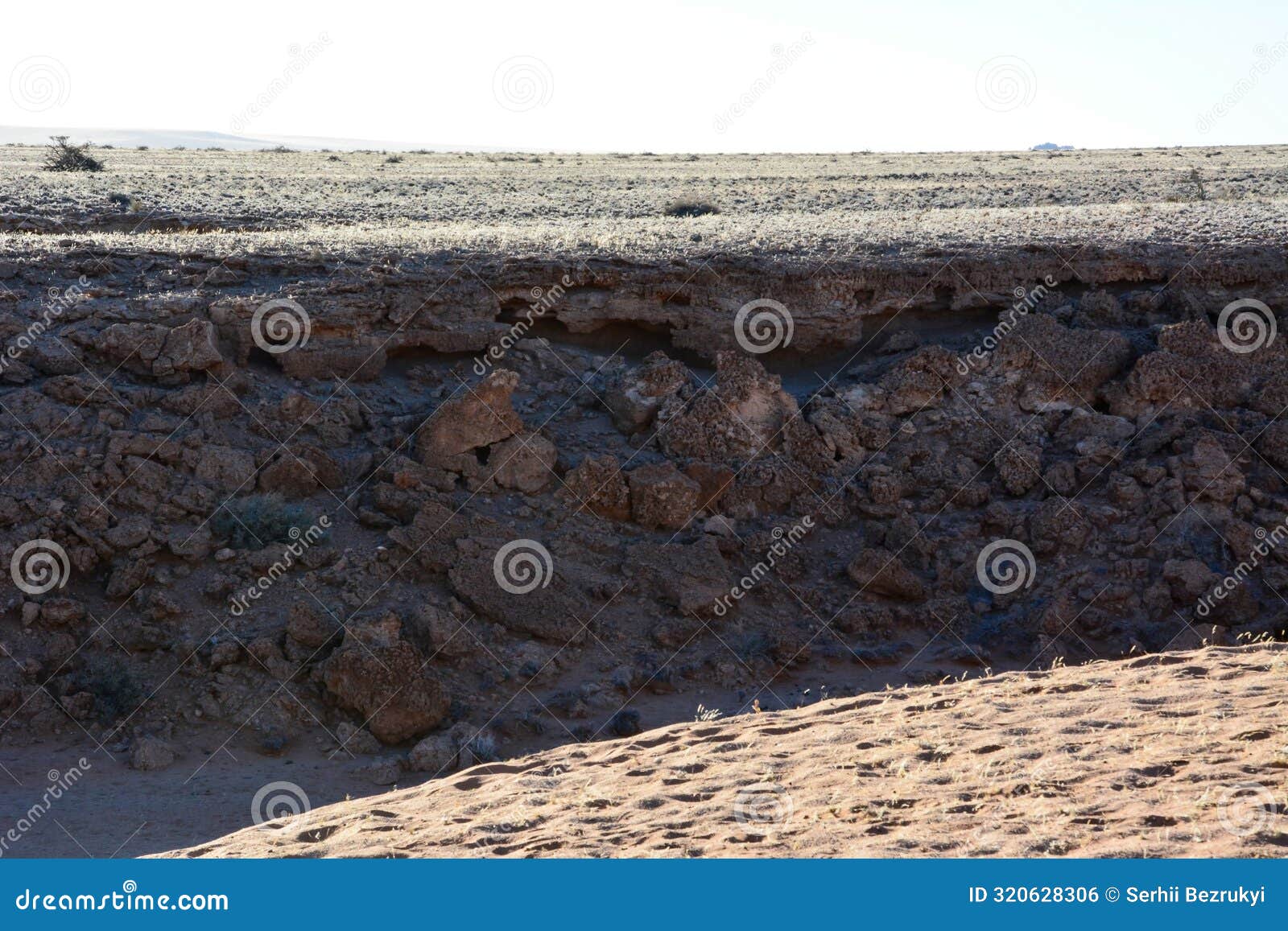 Rock Collapse in the Desert with Stones Falling into the Pit. Profile ...