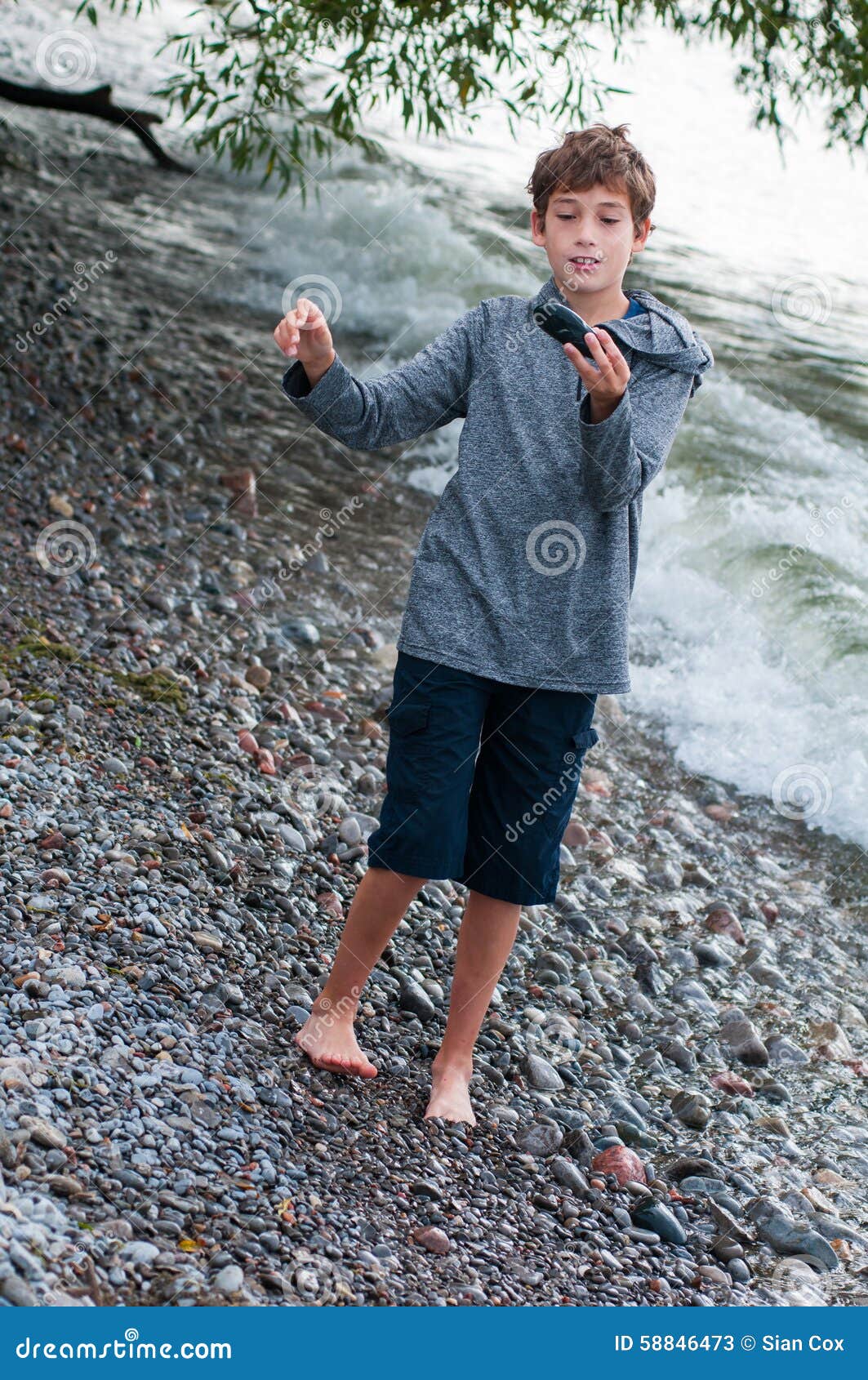 Rock collecting stock image. Image of water, rock, shore - 58846473