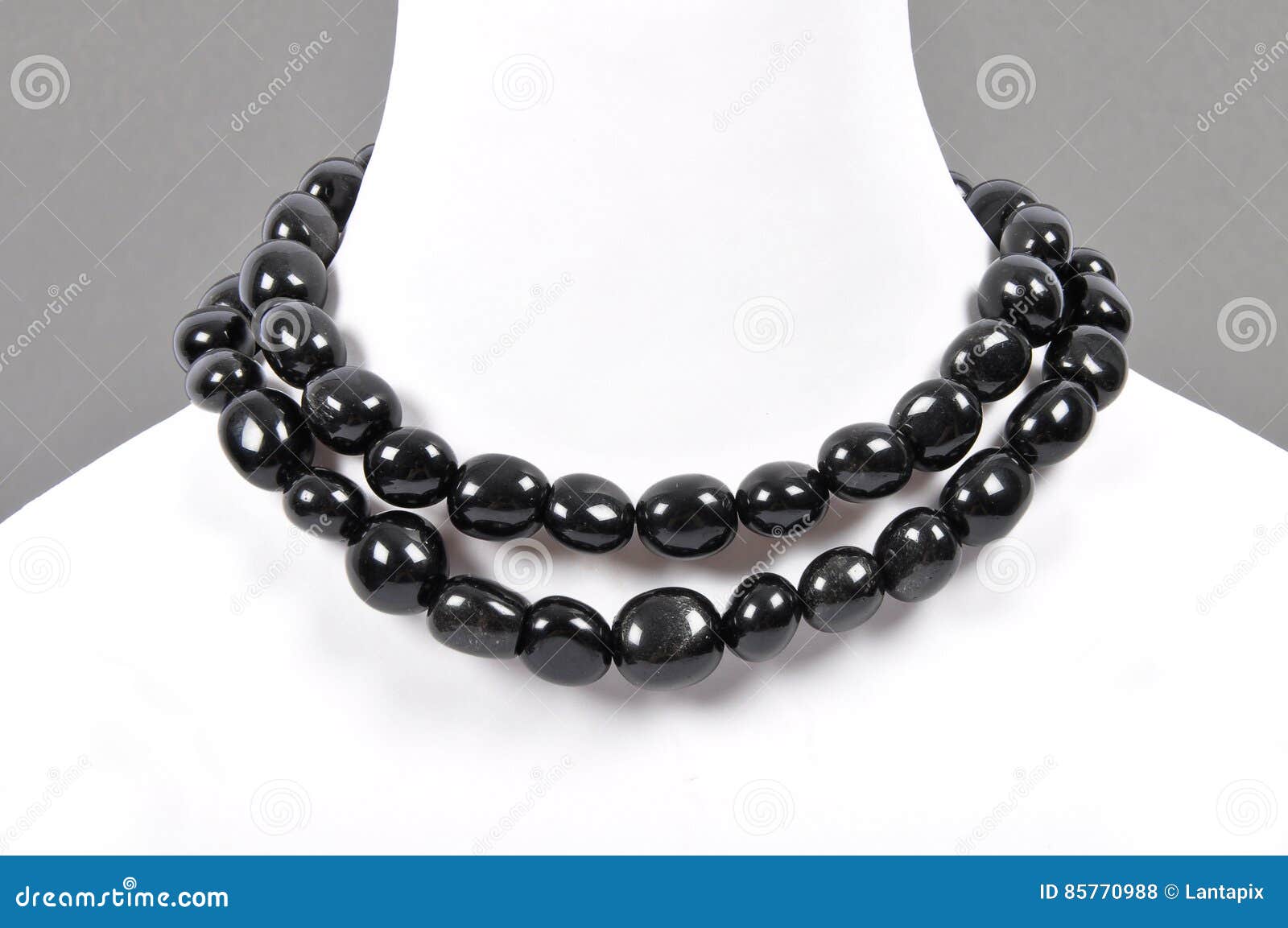 Rock Crystal and Snowflake Obsidian Chain on Bust Stock Photo - Image ...
