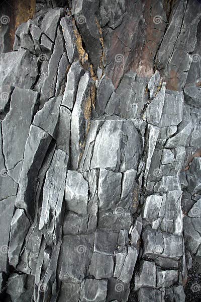 Rock face stock photo. Image of beach, gray, lava, vertical - 2101324