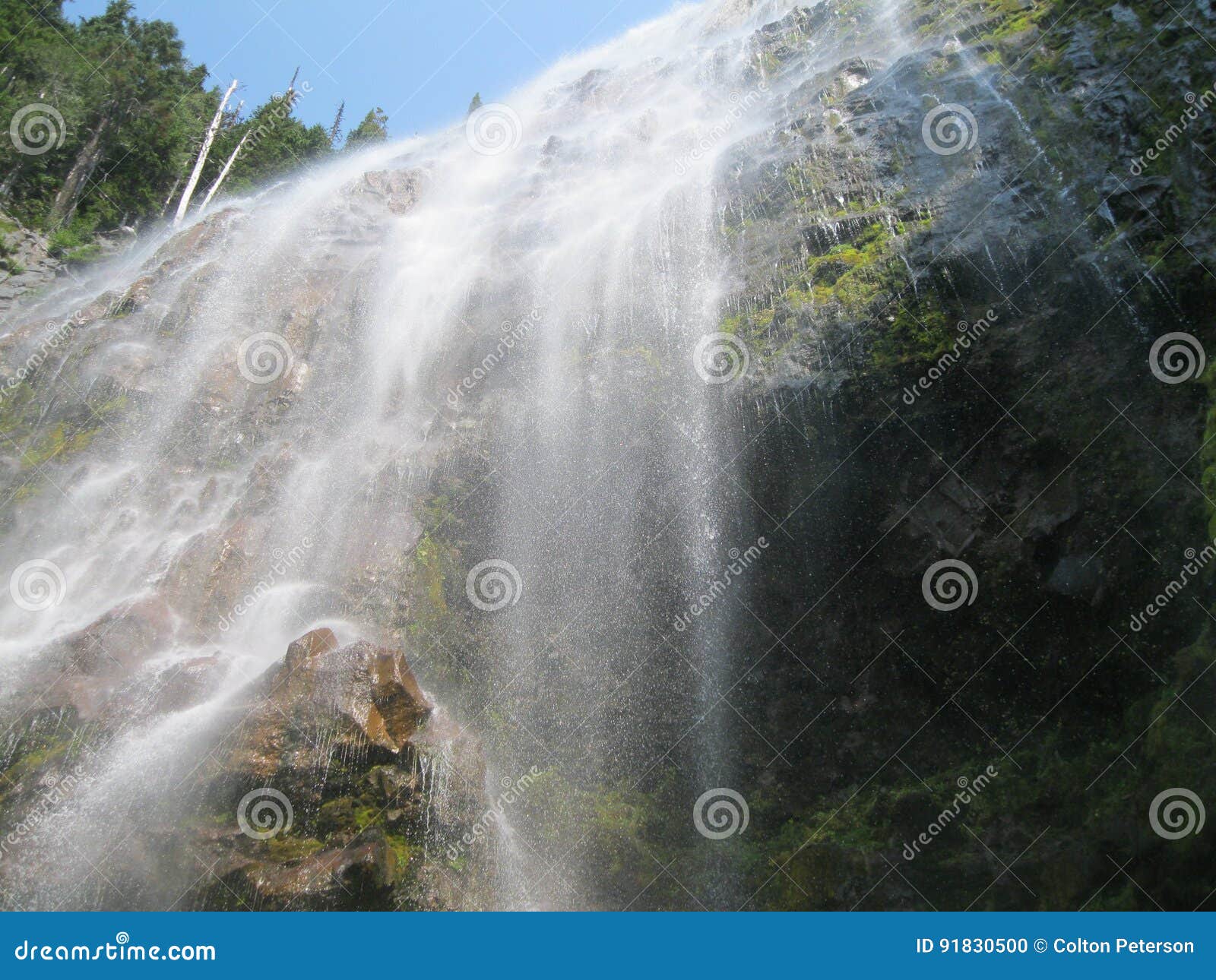 Rock face waterfall stock photo. Image of mist, clouds - 91830500