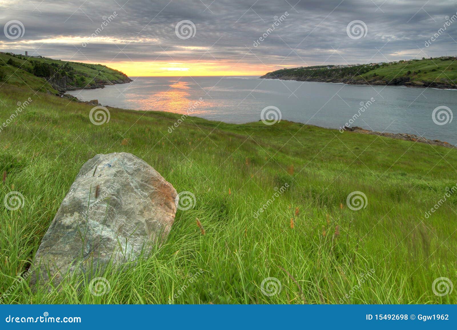 Rock in the Field stock photo. Image of seascape, grass - 15492698