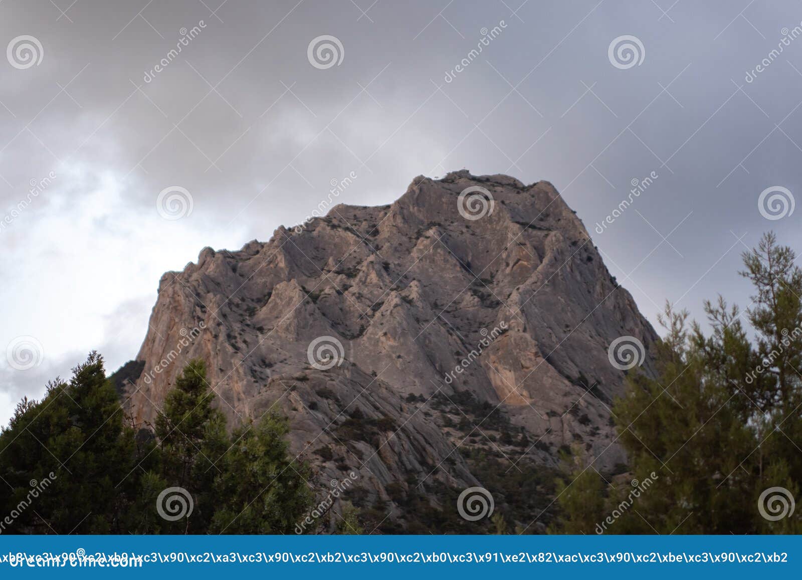 Rock in the Form of a Crown with Clouds Stock Photo - Image of rock ...